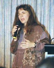 Mira speaking at a con #1