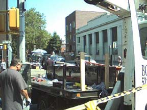 A sign being hung-up on 13th Avenue