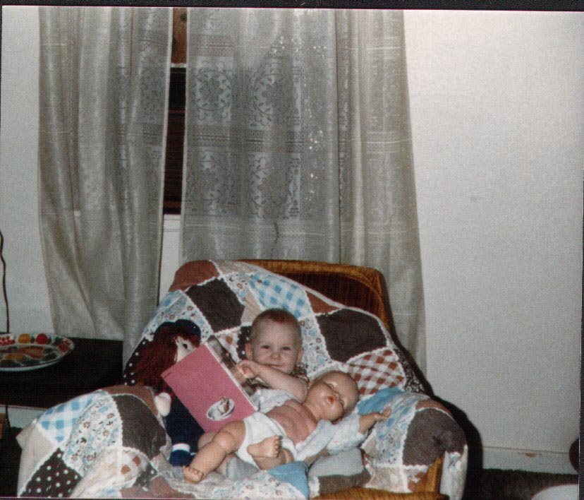 Chris reading to baby