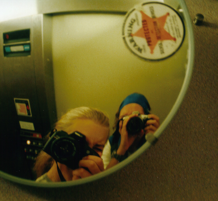 Photographers in the mirror (Photo by Laura Creecy)